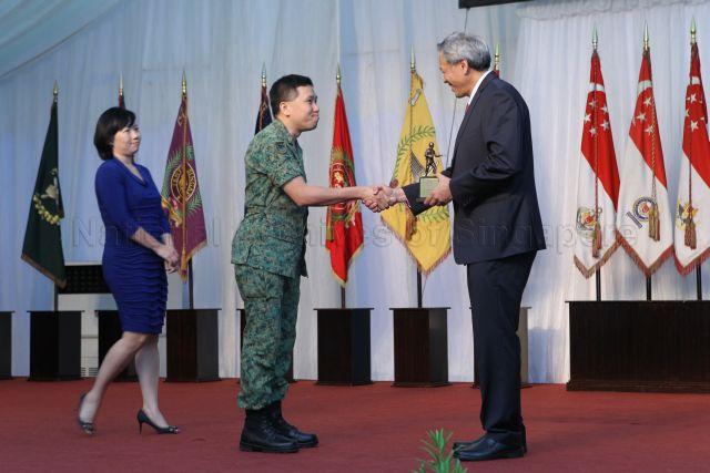 Minister for Defence Ng Eng Hen (right) presenting Singapore