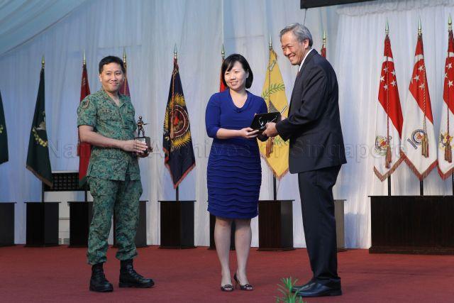 Minister for Defence Ng Eng Hen (right) presenting Singapore