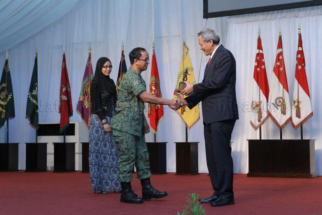 Minister for Defence Ng Eng Hen (right) presenting Singapore