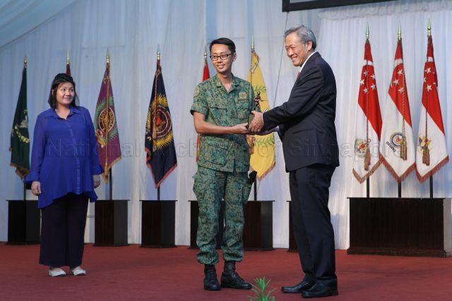 Minister for Defence Ng Eng Hen (right) presenting Singapore