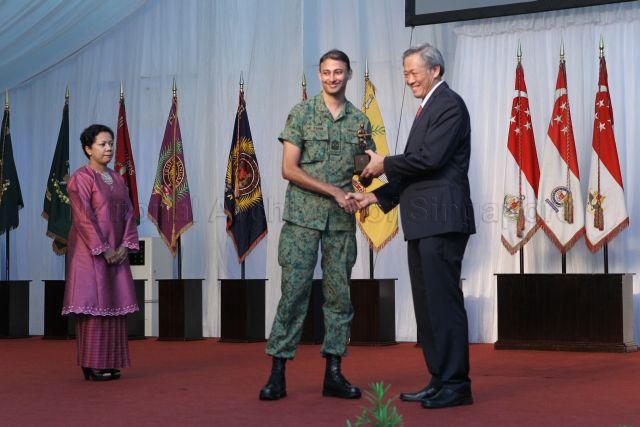 Minister for Defence Ng Eng Hen (right) presenting Singapore