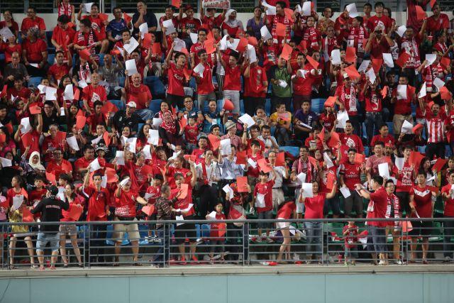 Football spectators during the match between LionsXII and