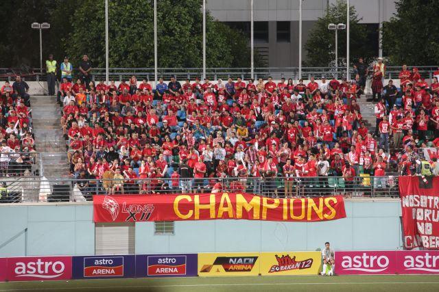 Football spectators during the match between LionsXII and