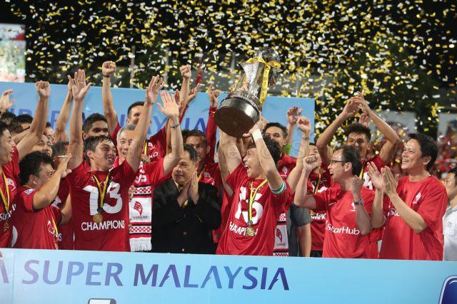 Prime Minister Lee Hsien Loong attending football match