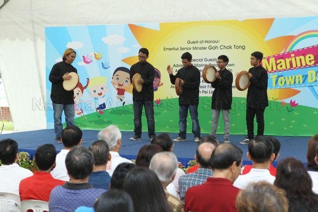Guests watching a kompang performance on stage during Marine