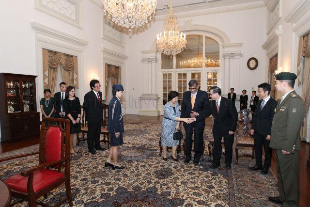 Chief Justice Sundaresh Menon (right) is standing next to