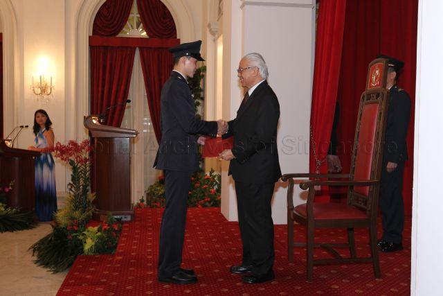 Timothy Yap Wei Hang is receiving the President's