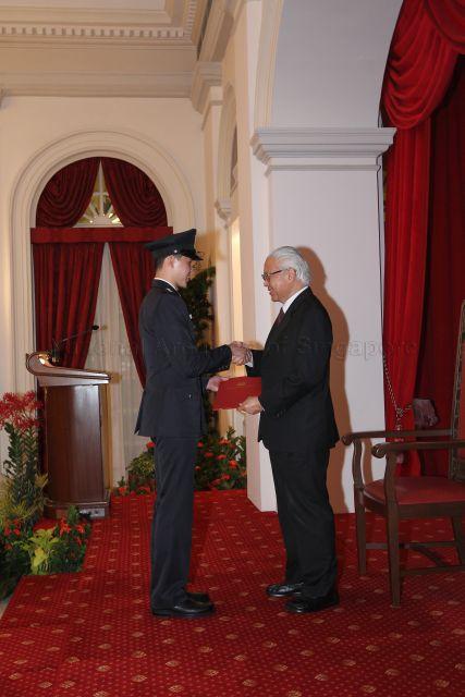 Timothy Yap Wei Hang is receiving the President's