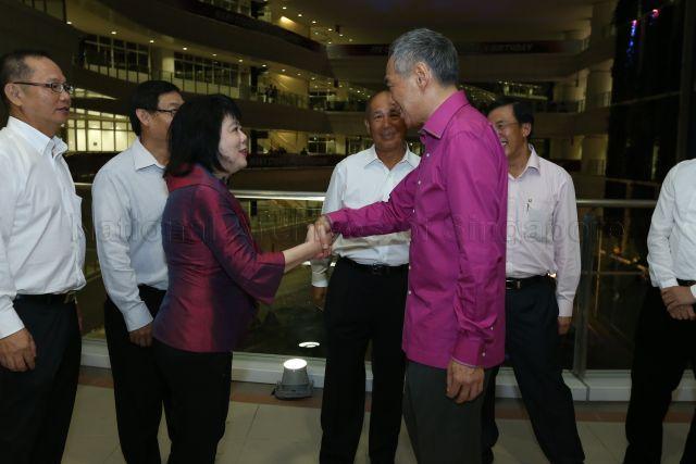 Prime Minister Lee Hsien Loong being greeted by Deputy Chief