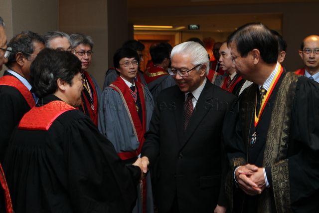 President Tony Tan Keng Yam is shaking hands with an