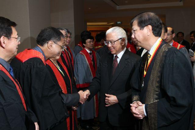 President Tony Tan Keng Yam is shaking hands with an