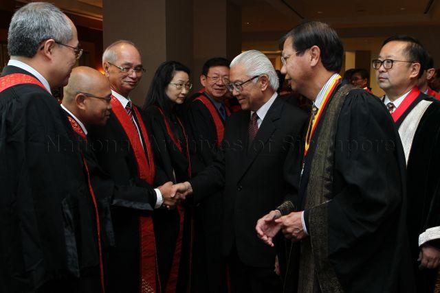 President Tony Tan Keng Yam is shaking hands with an