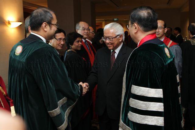 President Tony Tan Keng Yam is shaking hands with an
