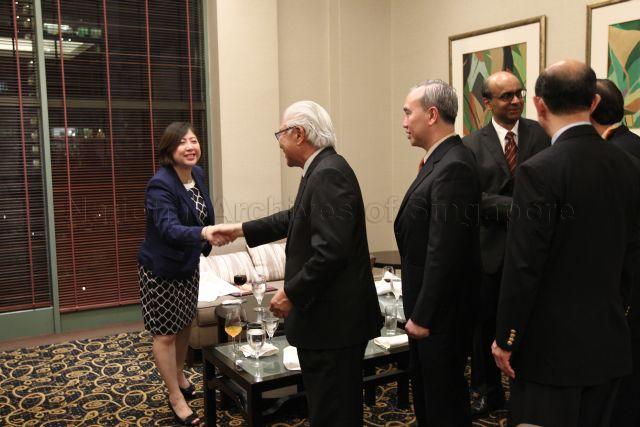 President Tony Tan Keng Yam is shaking hands with an
