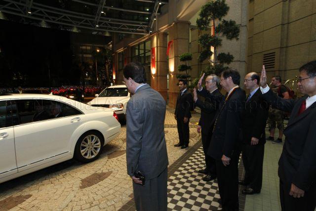 Officials waving farewell as President Tony Tan Keng Yam