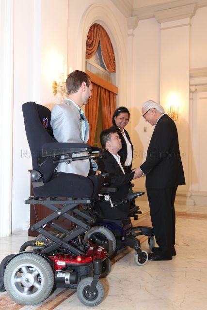 President Tony Tan (4th from left) shaking hands with Jason