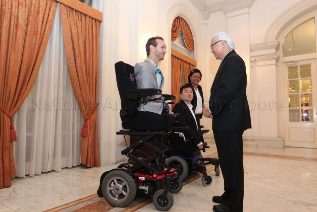 President Tony Tan (4th from left) conversing with Nick