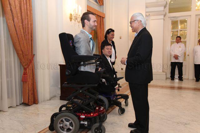 President Tony Tan (4th from left) conversing with Nick