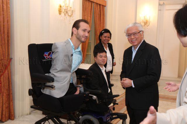President Tony Tan (4th from left) conversing with Nick