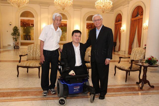 President Tony Tan (3rd from left) is posing for a photo