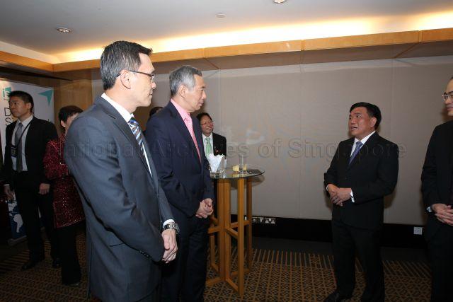 Prime Minister Lee Hsien Loong interacting with guests at