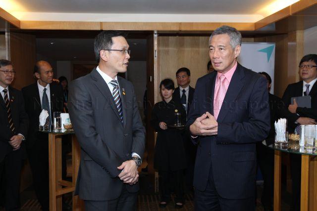 Prime Minister Lee Hsien Loong conversing with Chief