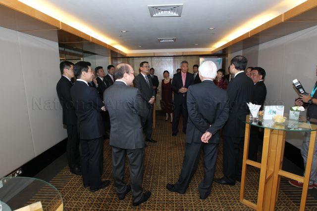 Prime Minister Lee Hsien Loong interacting with guests at