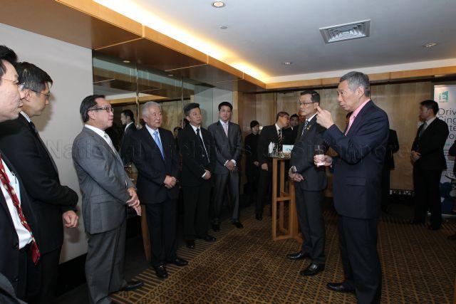 Prime Minister Lee Hsien Loong interacting with guests at