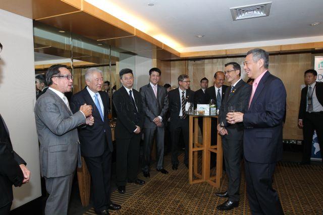 Prime Minister Lee Hsien Loong interacting with guests at