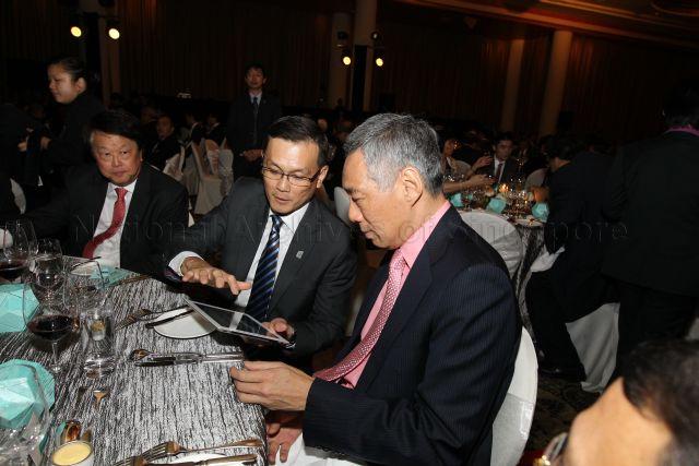 Prime Minister Lee Hsien Loong seated at the VIP table