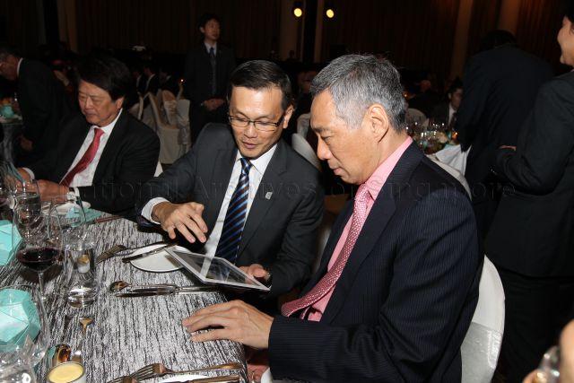 Prime Minister Lee Hsien Loong seated at the VIP table