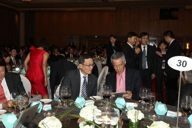 Prime Minister Lee Hsien Loong seated at the VIP table
