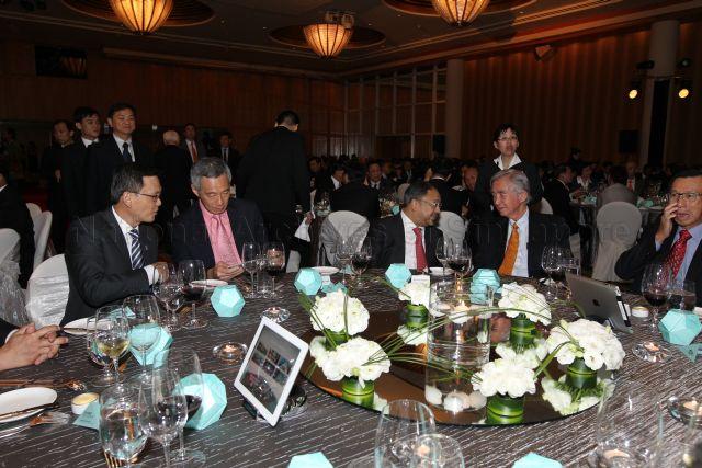 Prime Minister Lee Hsien Loong seated at the VIP table