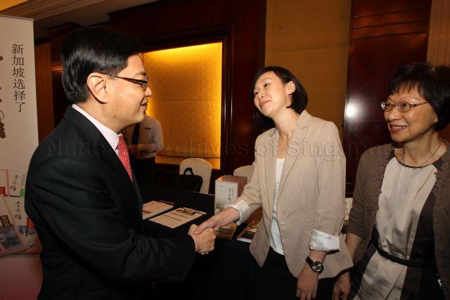 Minister for Education Heng Swee Keat shaking hands with