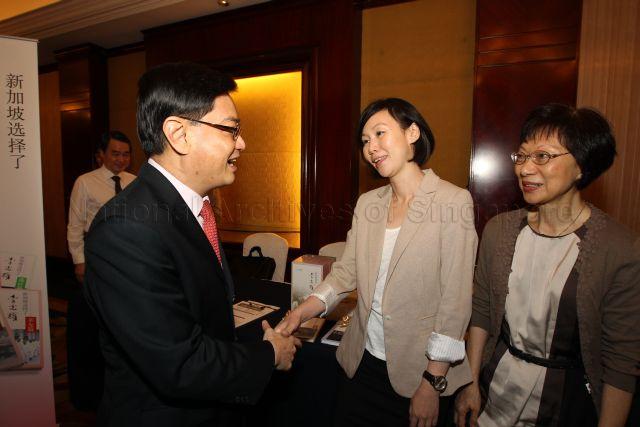 Minister for Education Heng Swee Keat shaking hands with