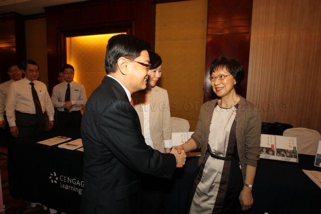 Minister for Education Heng Swee Keat shaking hands with