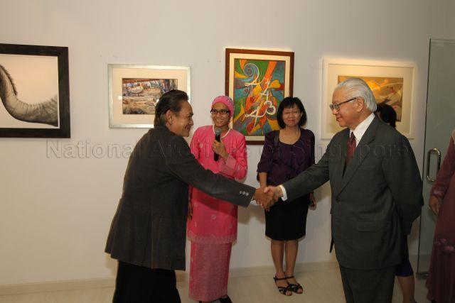 President Tony Tan and his wife Mrs Mary Tan (hidden) being