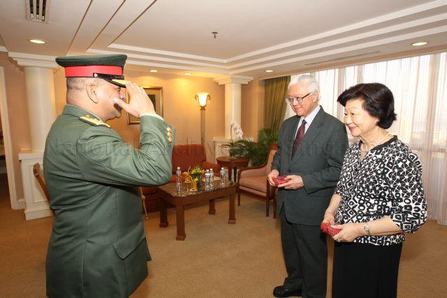 President Tony Tan and his wife Mrs Mary Tan, presenting a