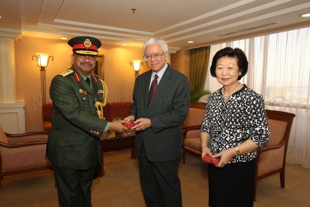 President Tony Tan and his wife Mrs Mary Tan, presenting a