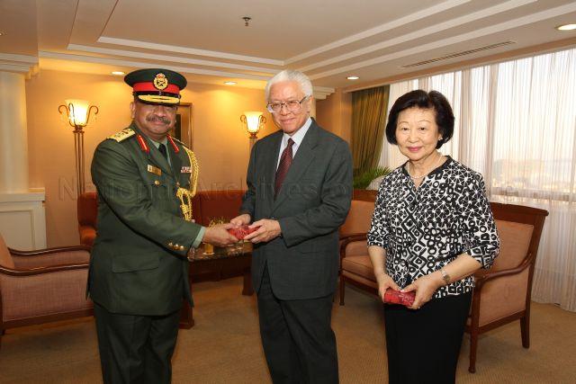 President Tony Tan and his wife Mrs Mary Tan, presenting a