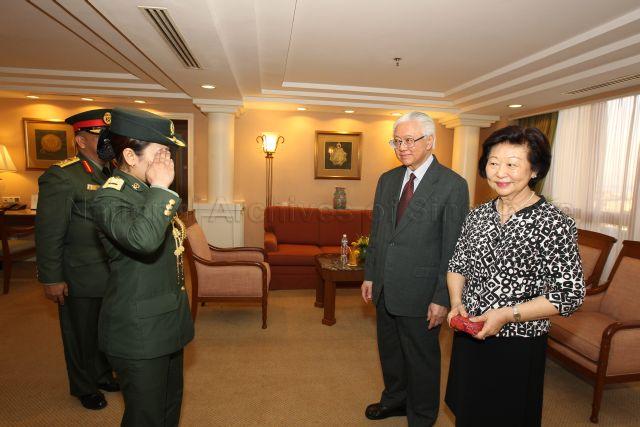 President Tony Tan and his wife Mrs Mary Tan, presenting a