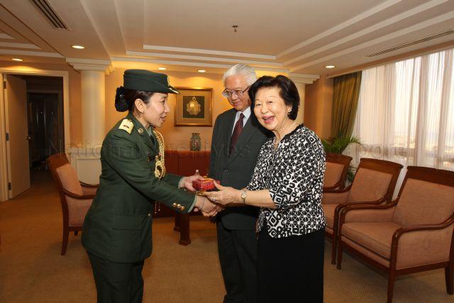 President Tony Tan and his wife Mrs Mary Tan, presenting a