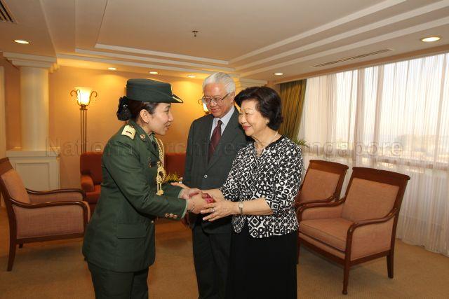 President Tony Tan and his wife Mrs Mary Tan, presenting a