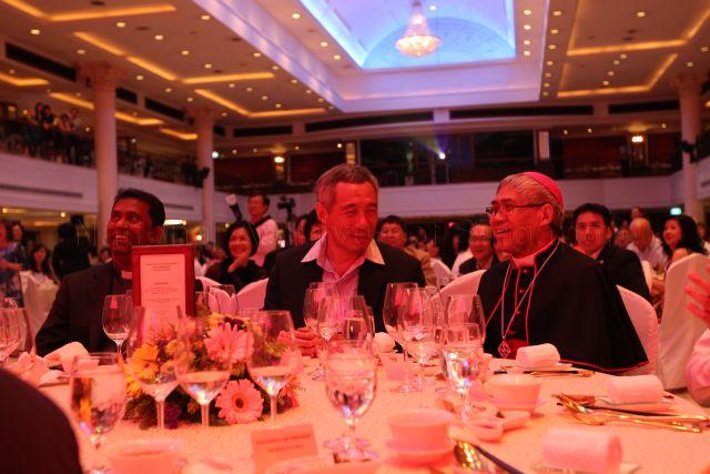 Prime Minister Lee Hsien Loong, (on his left) Archbishop