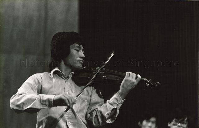 Lee Pan Hon rehearsing for the 21st Anniversary Concert of