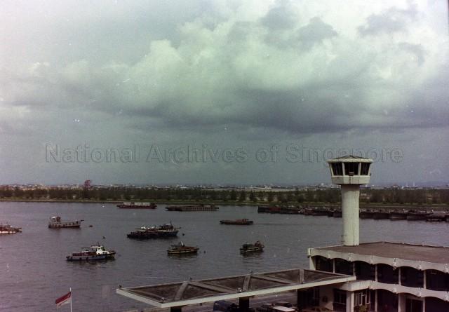 View of a busy harbour in Marina Bay with many boats and a