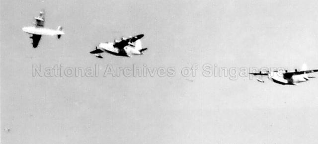Photograph of three aircraft in flight formation taken
