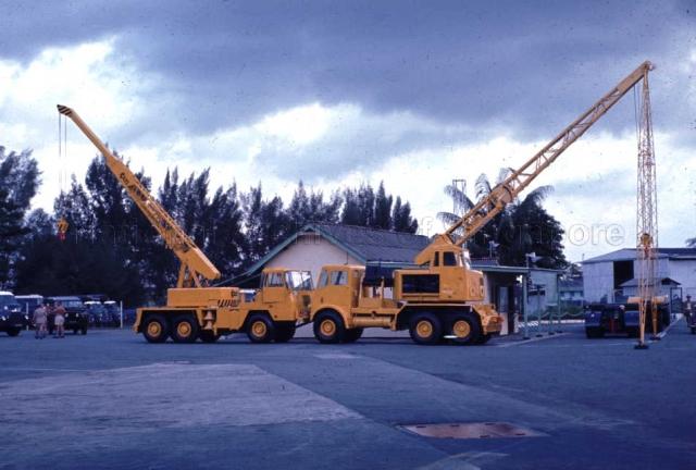 Photograph of two cranes in a parking area at Royal Air