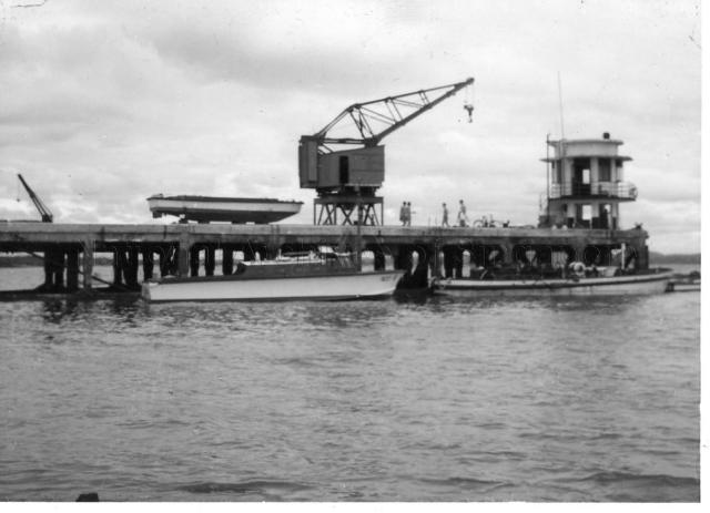 Photograph of two launches moored beside the Seletar Jetty