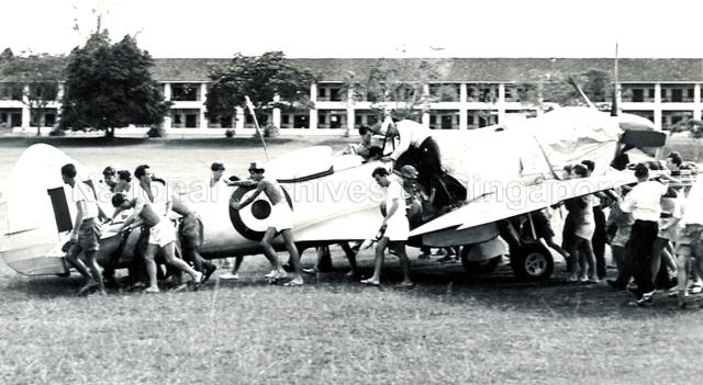 Photograph of a Supermarine Spitfire, SM997, being pushed by